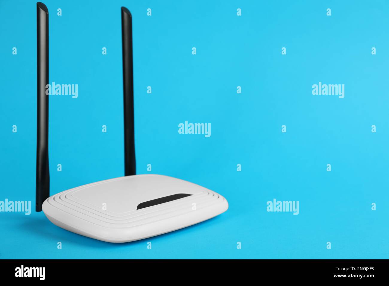 Modern Wi-Fi router on light blue background. Space for text Stock ...
