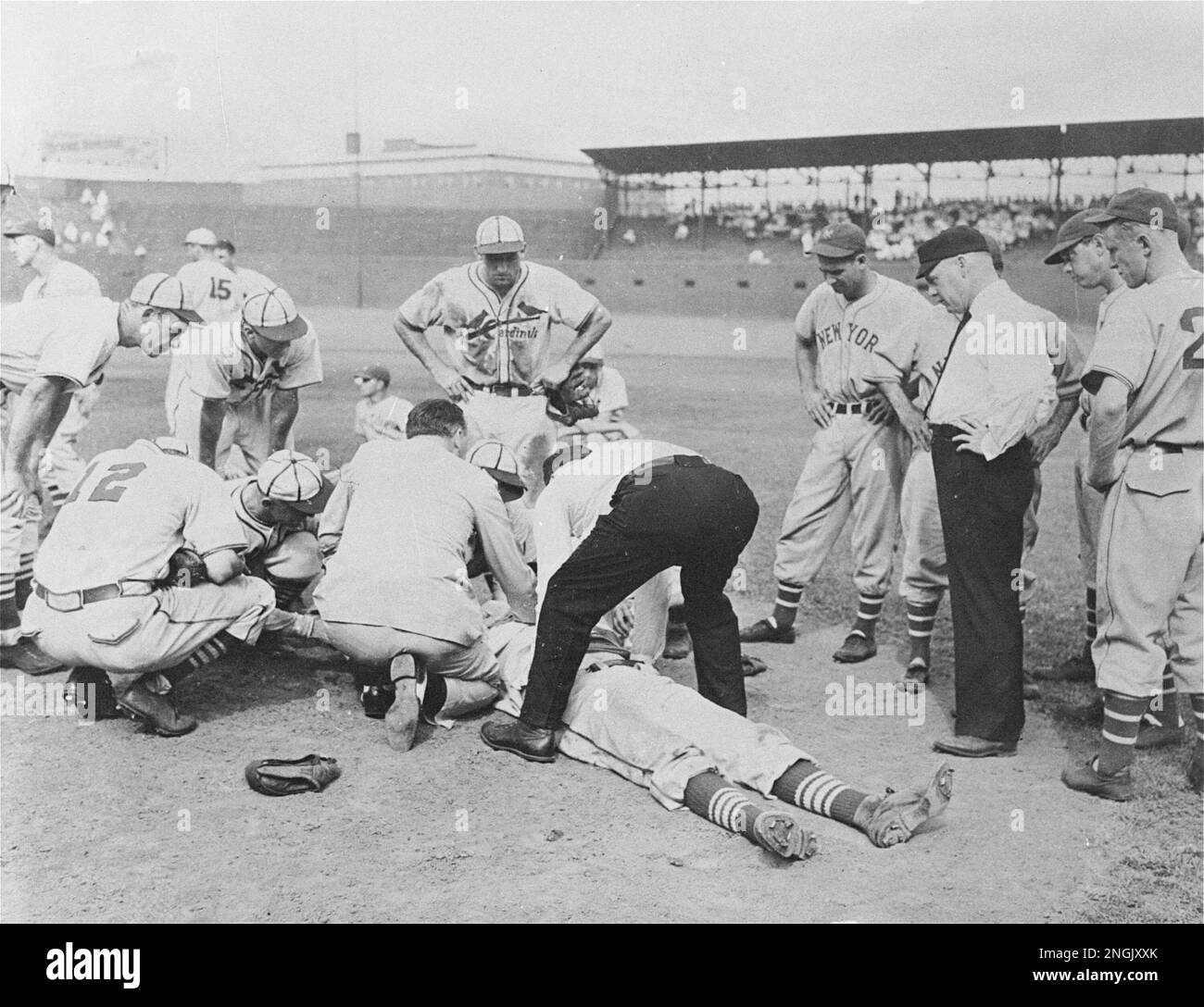 Dizzy Dean, star pitcher of the St. Louis Cardinals, received first aid ...