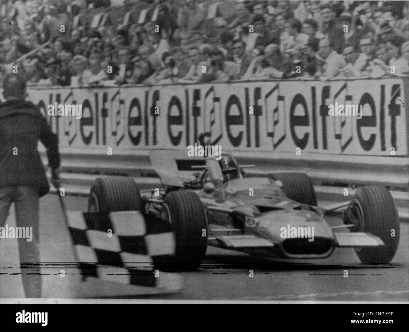 Graham Hill of England crosses the finish line and wins his fifth Monte ...