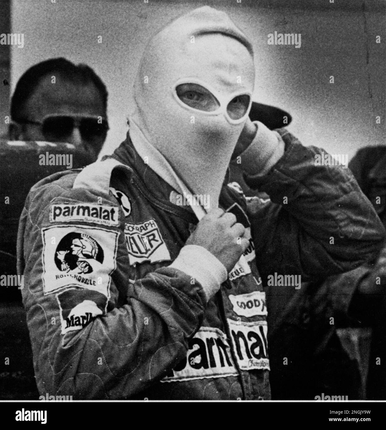 Niki Lauda of Austria pulls his protective hood over his head Friday ...