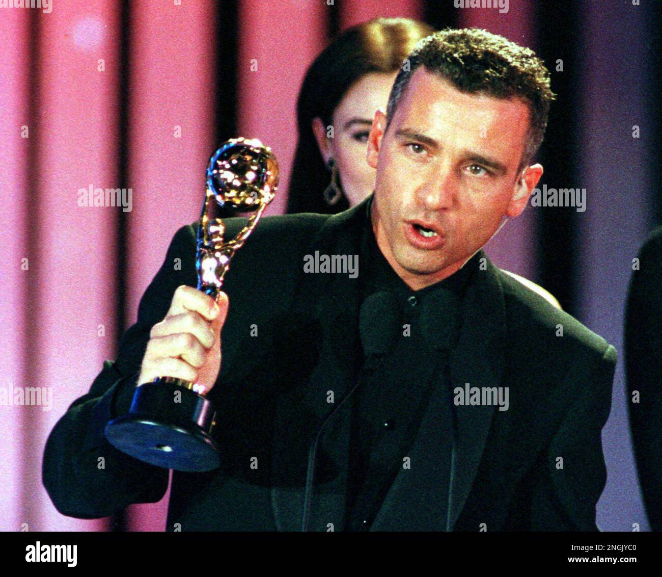 Italian singer Eros Ramazzotti waves his music award for the World's ...