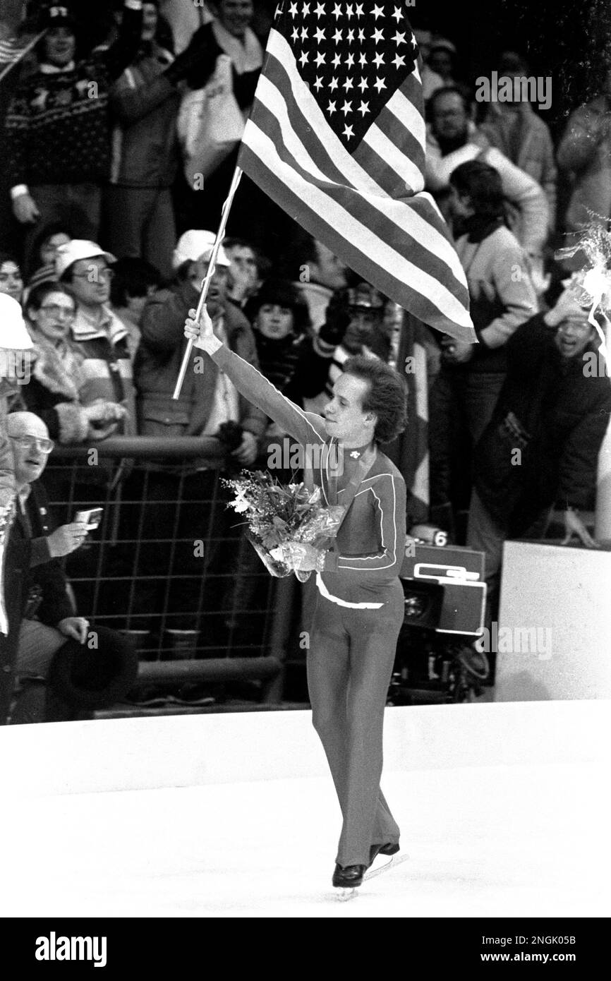 U.S. figure skater Scott Hamilton of Denver, Colorado, carries a U.S ...