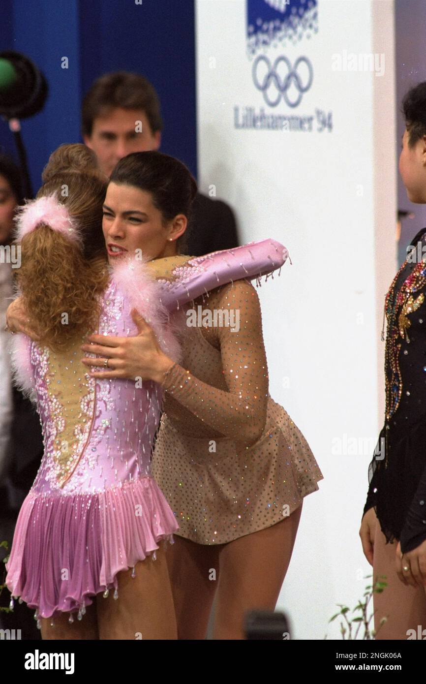 American silver medal winner Nancy Kerrigan, right, hugs gold medal winner Oksana Baiul from the ...
