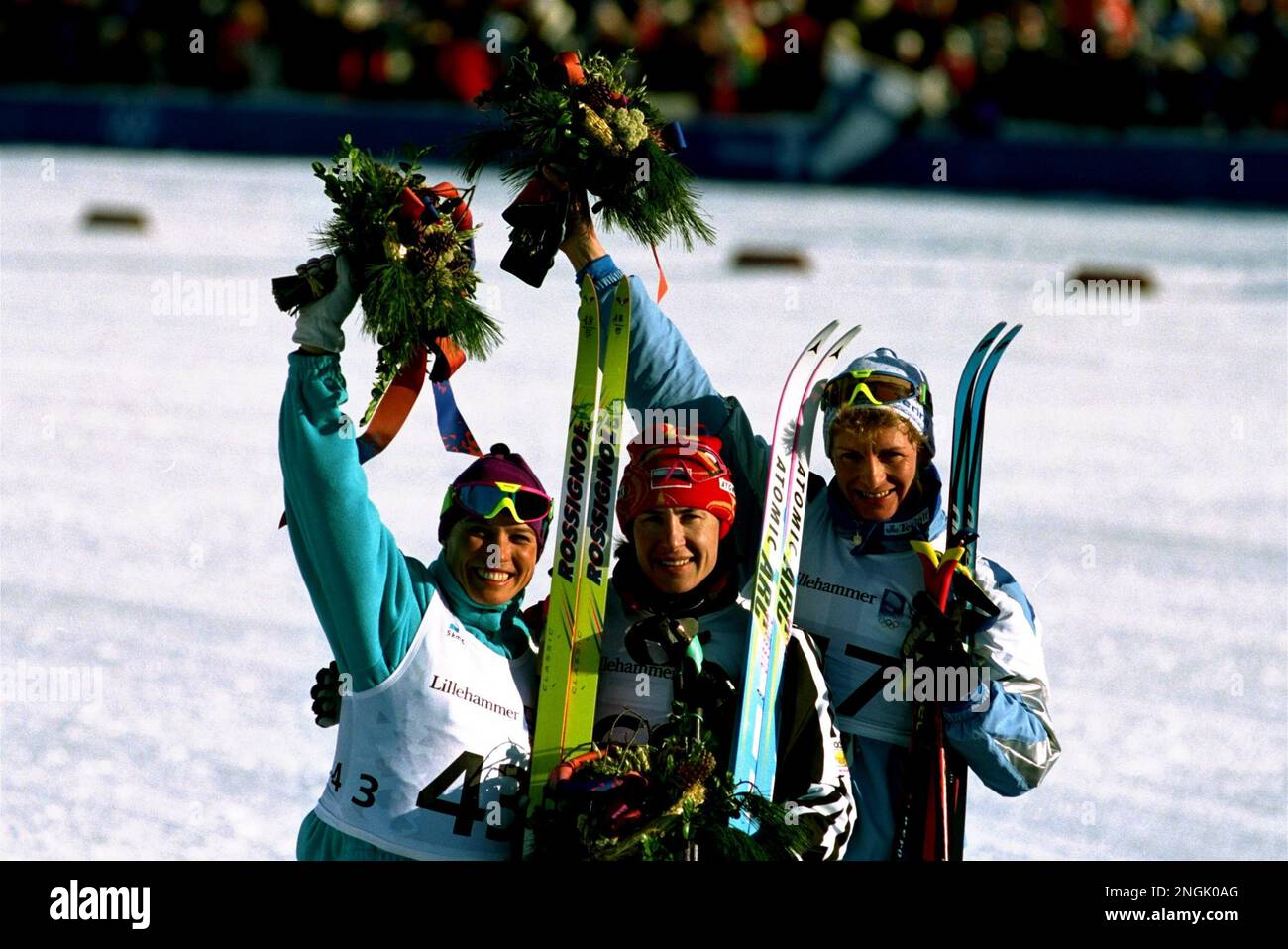 The top three finishers of the women's five kilometer classic style ...
