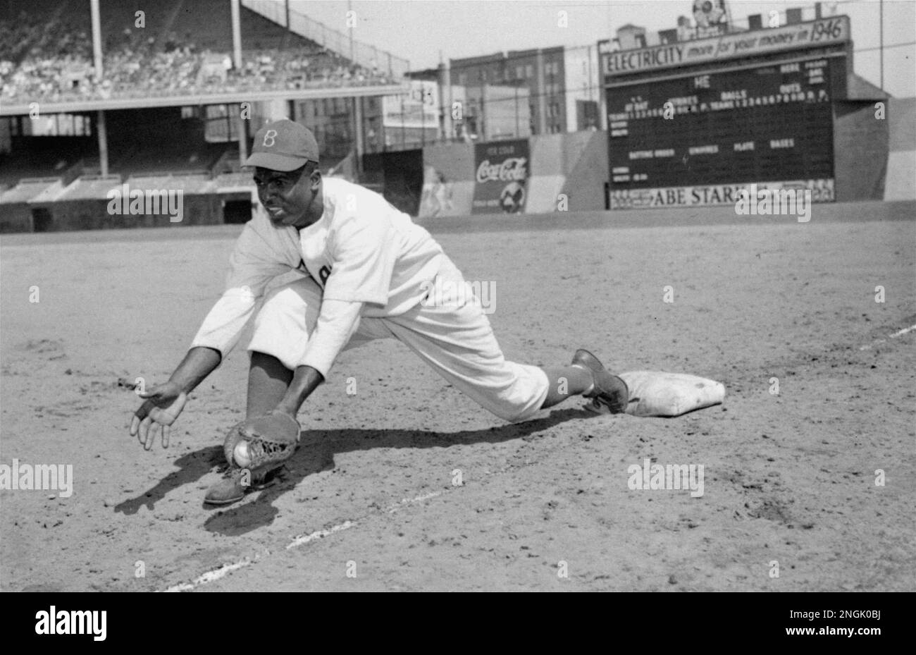 Jackie Robinson, Brooklyn Dodgers' first baseman, is shown at Ebbets ...