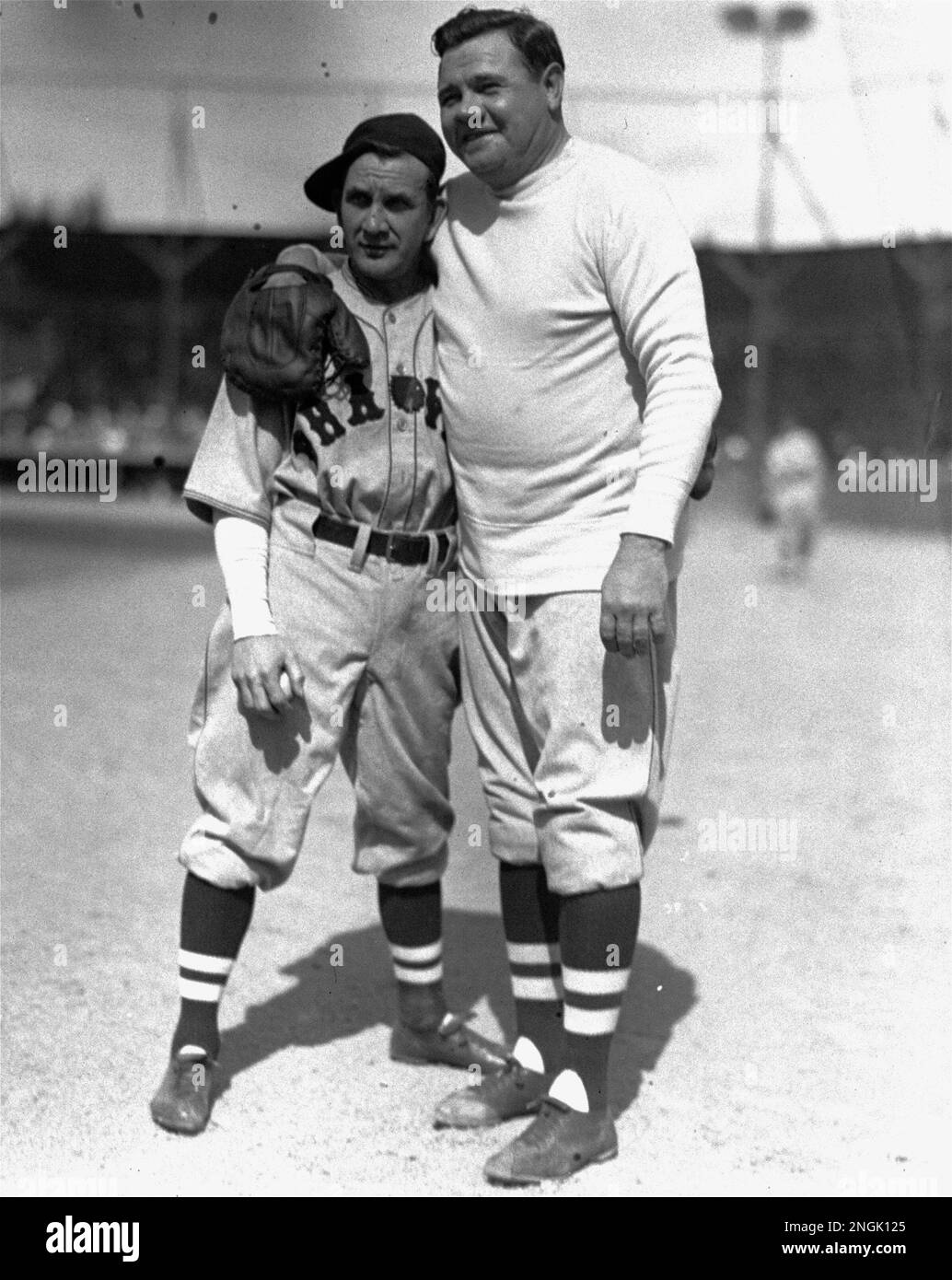 Babe Ruth and Rabbit Maranville, veteran stars of the major leagues shown at the training camp ...