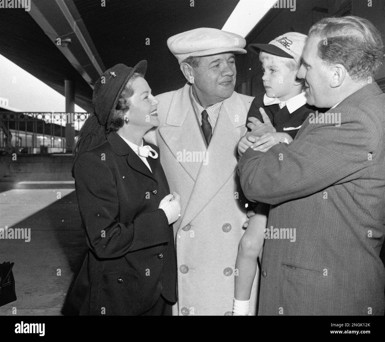 Babe Ruth smiles a greeting to Charley Dunsmoor, four-year-old son of ...