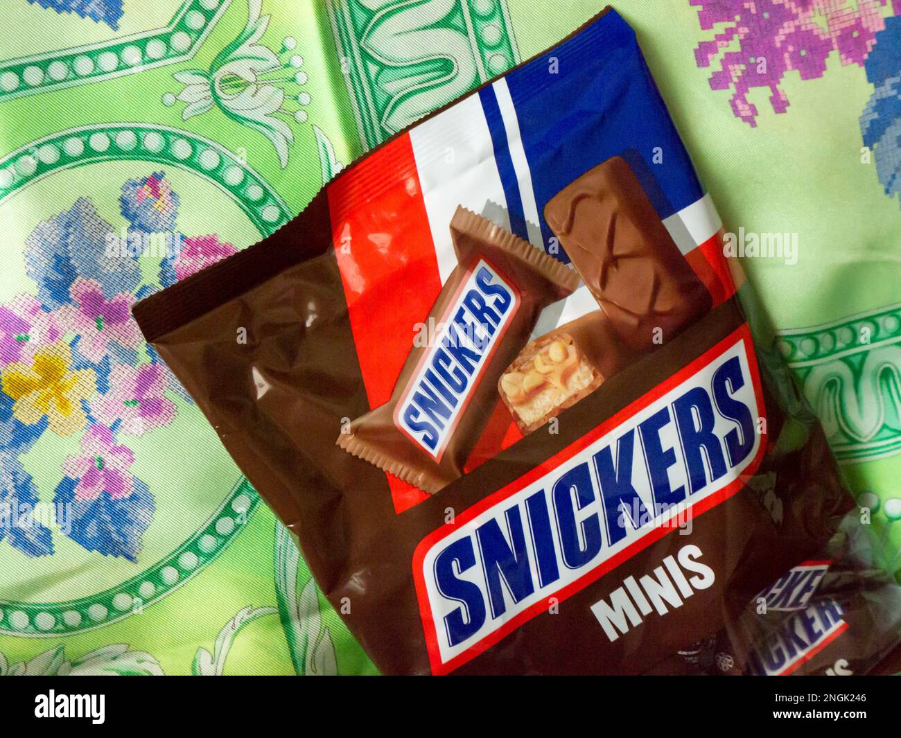Сhocolate bar Snickers on a brown background Stock Photo - Alamy