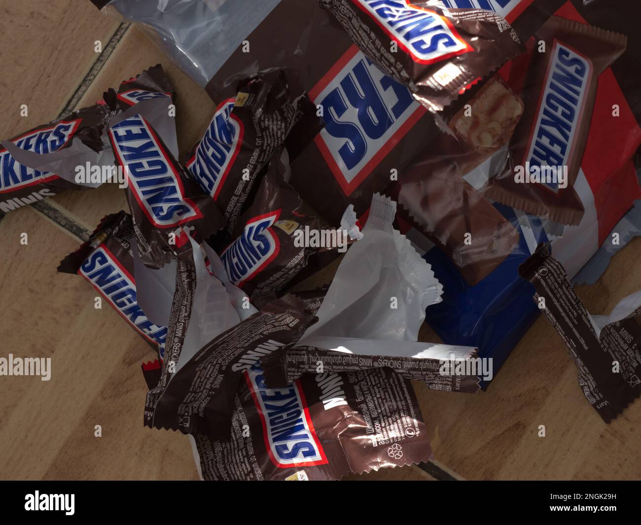 Сhocolate bar Snickers on a brown background Stock Photo - Alamy