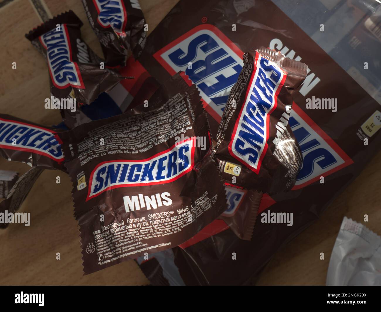 Сhocolate bar Snickers on a brown background Stock Photo - Alamy