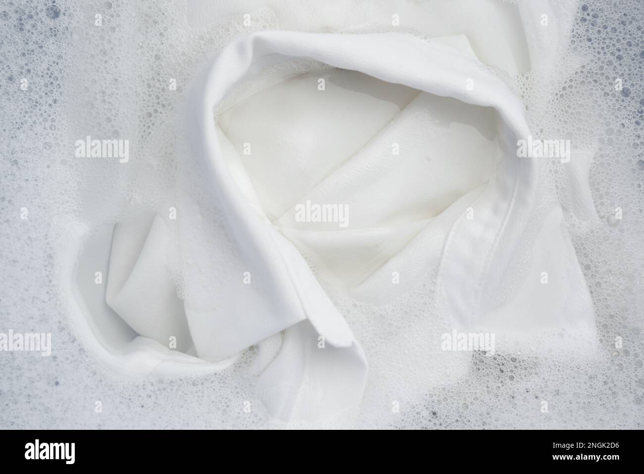 White clothing in suds, top view. Hand washing laundry Stock Photo - Alamy