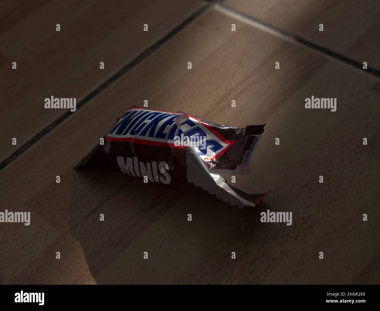 Сhocolate bar Snickers on a brown background Stock Photo - Alamy