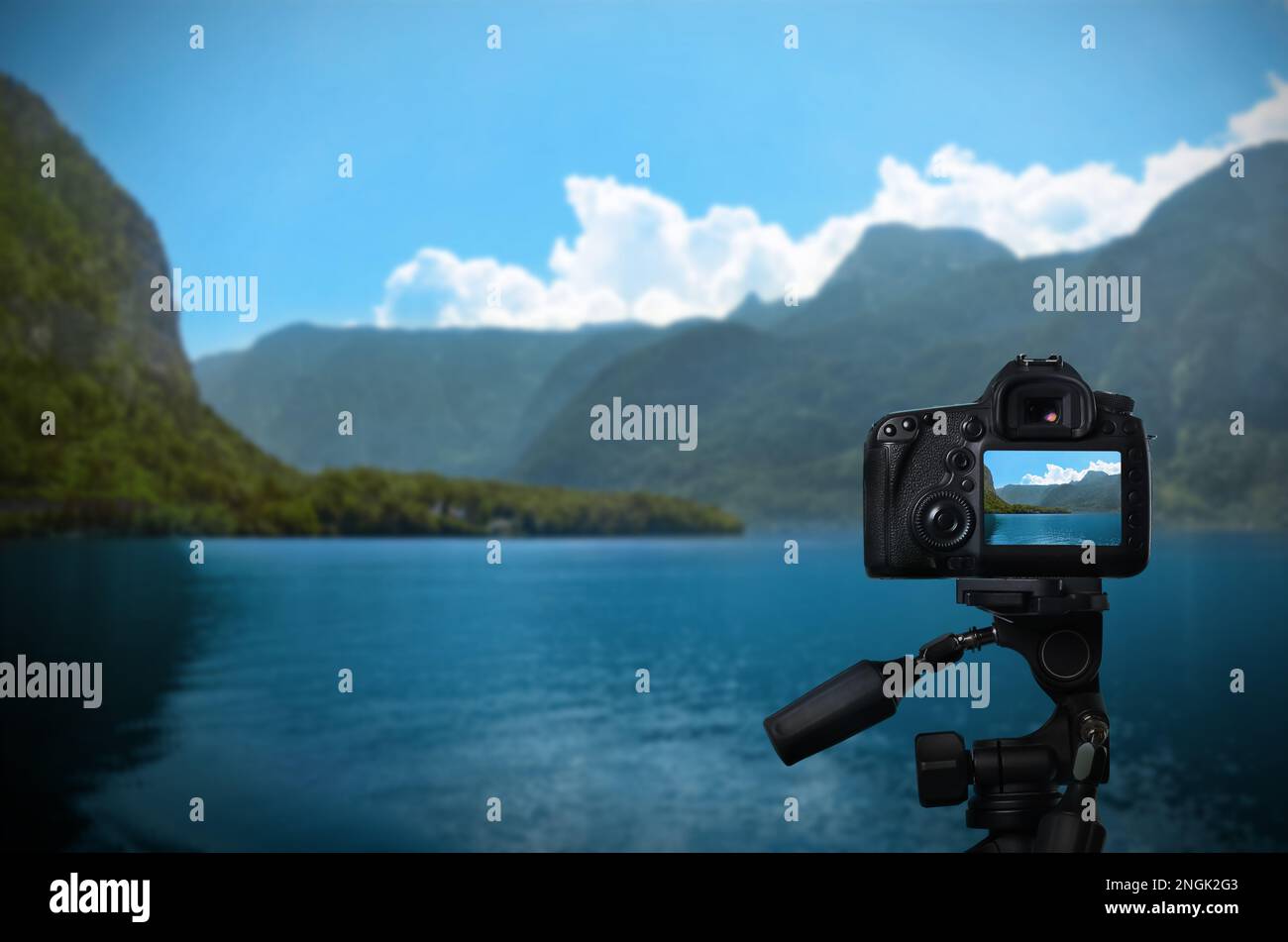 Taking photo of beautiful river and mountains with camera mounted on ...