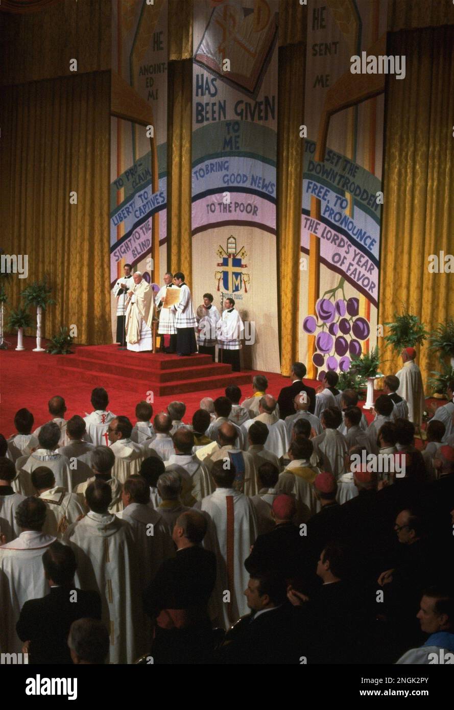 Pope John Paul II is shown celebrating mass at the alter in ...