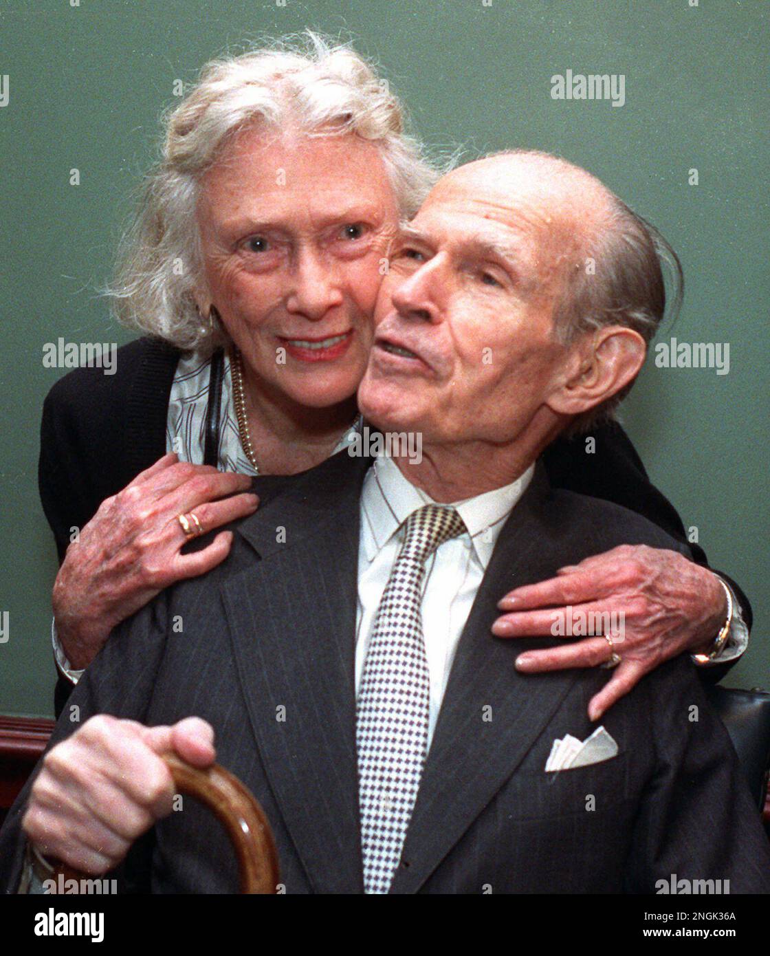 Alger Hiss is shown getting a hug from his second wife Isabel in this ...