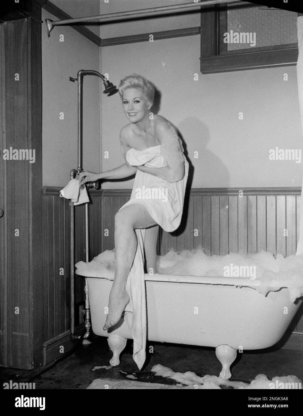 Actress Kim Novak, one of Hollywood's younger stars, steps from an ...