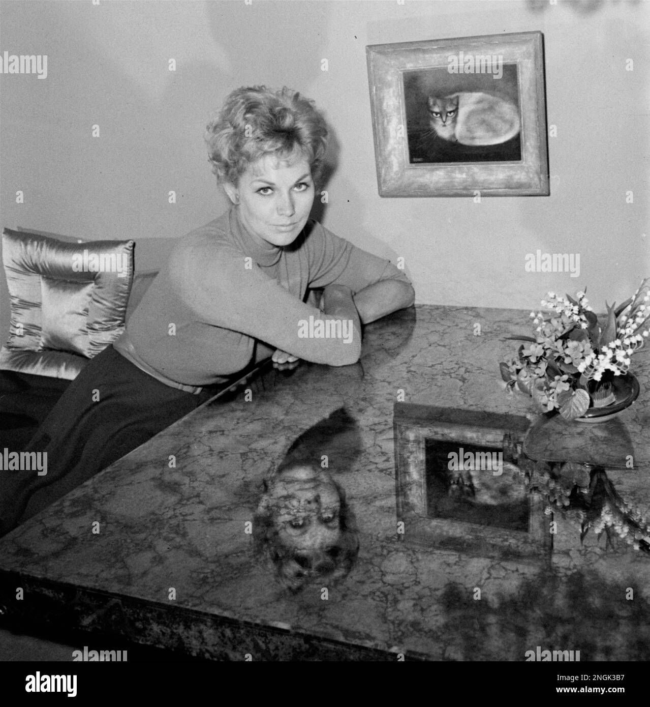 Film actress Kim Novak is shown November 14, 1958 at home in her newly ...