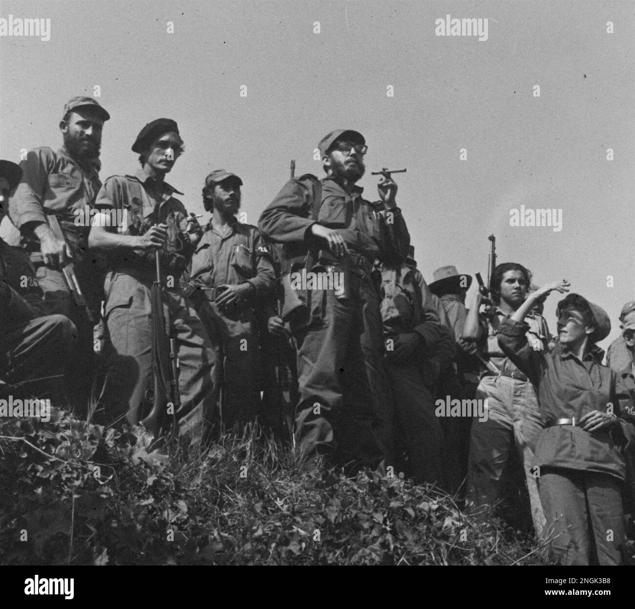Soldiers of Rebel Chief Fidel Castro take positions on road bank as the ...