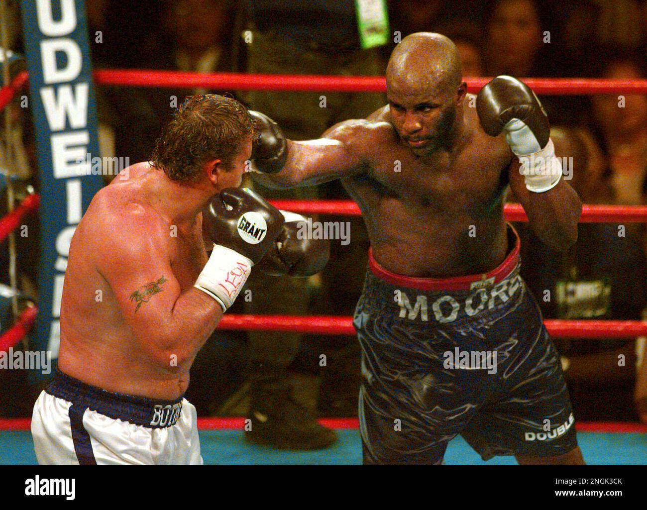 Michael Moorer of Detroit, Mich., right, delivers a punch to South ...