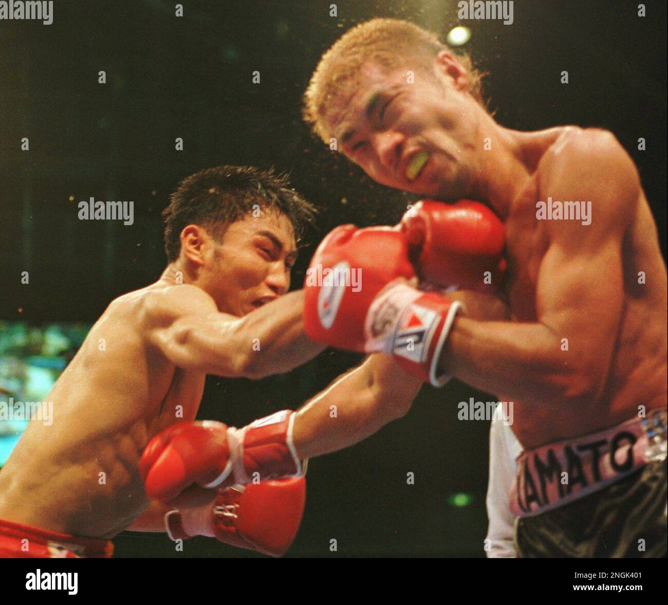 South Korean champion Choi Yong-soo, left, lands his right on the face ...