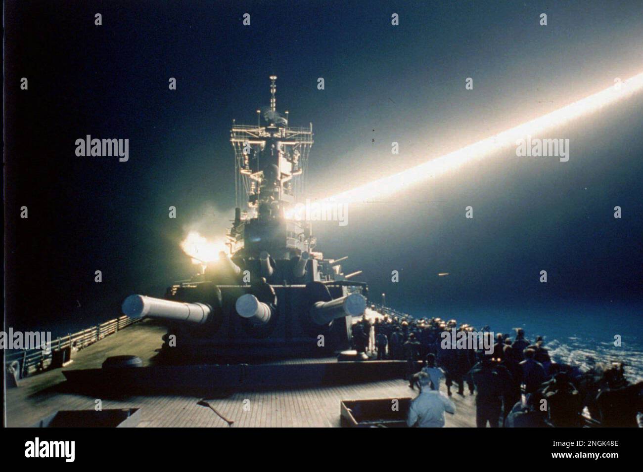 A Tomahawk cruise missile lights up the night sky as it is fired from ...
