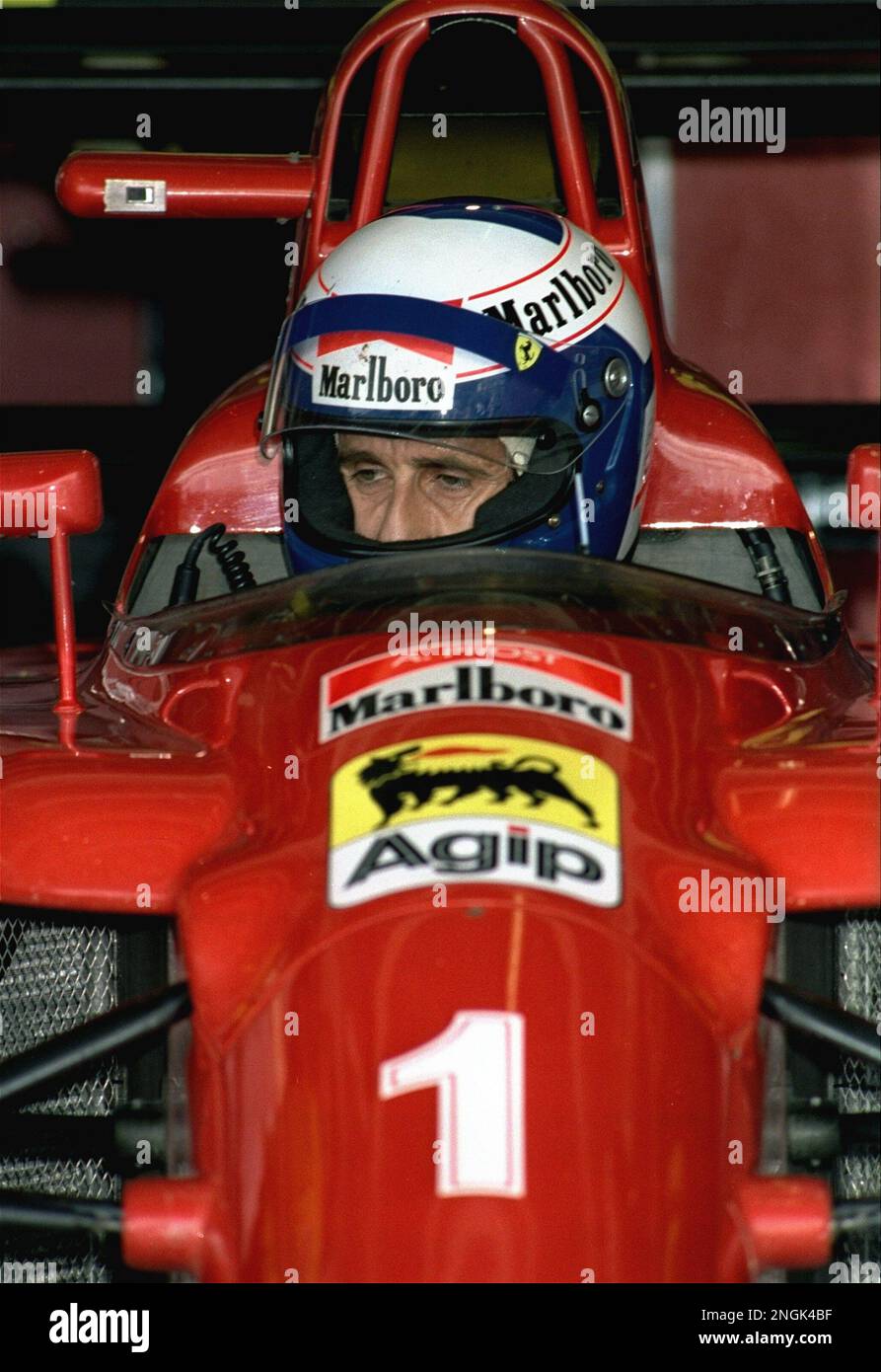 Formula One champion Alain Prost of France sits in a Ferrari October 19 ...
