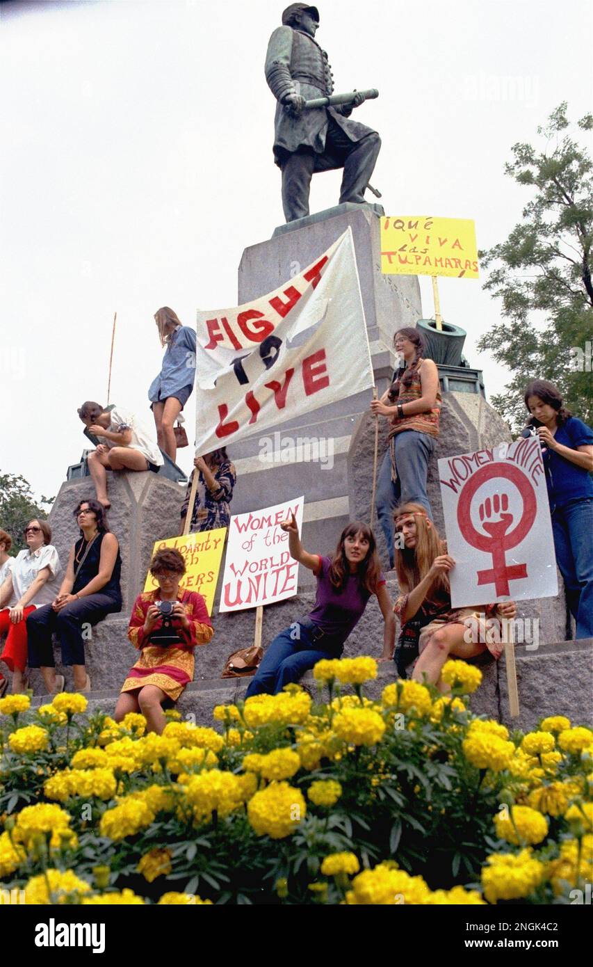 Women have climbed the statue of Admiral David G. Farragut, to display ...