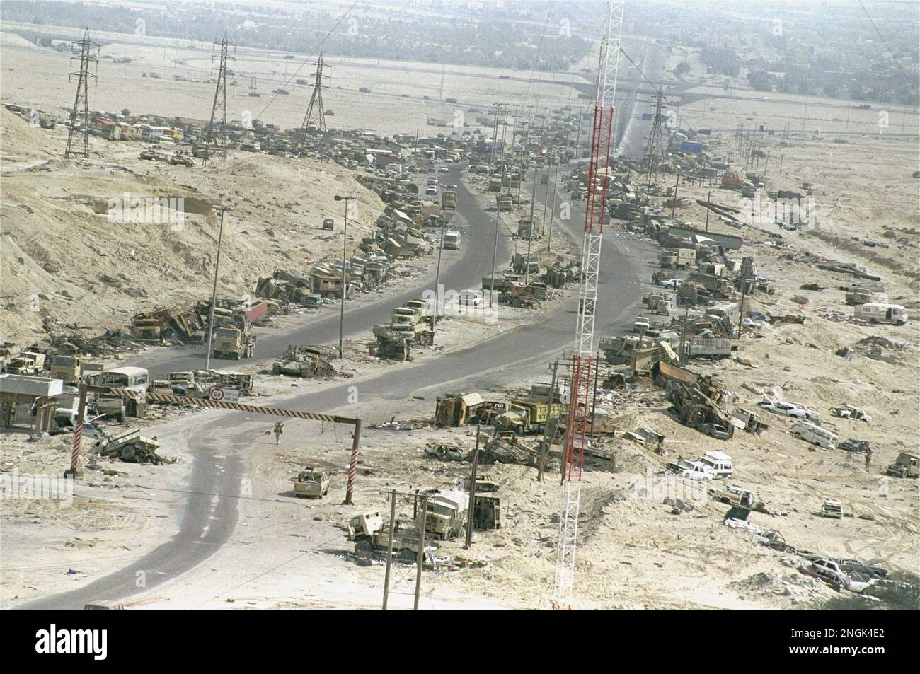 Two lanes are carved through the wreckage of an Iraqi convoy, still ...
