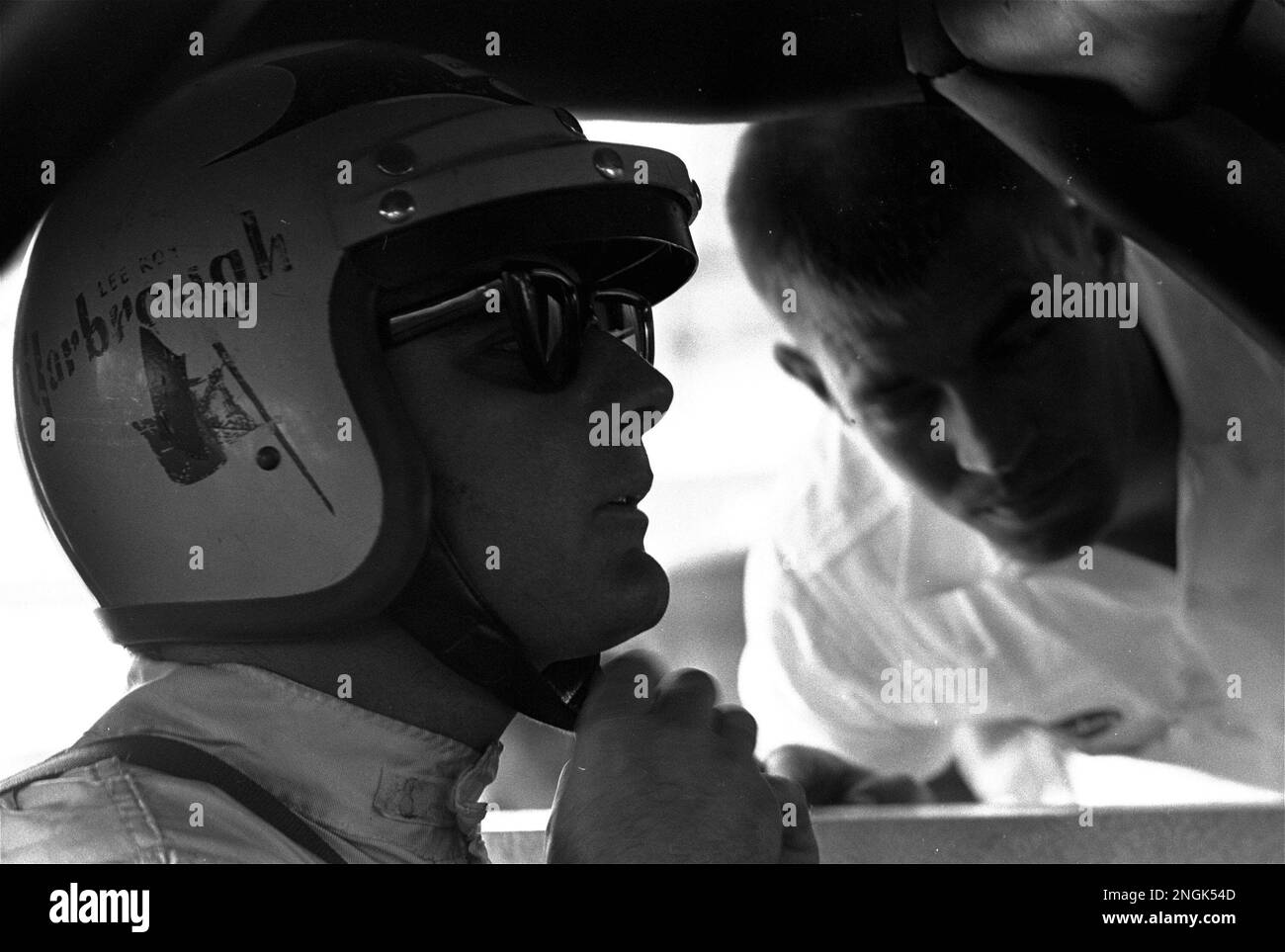 Lee Roy Yarbrough adjusts his helmet while sitting inside his 1966 Ford ...