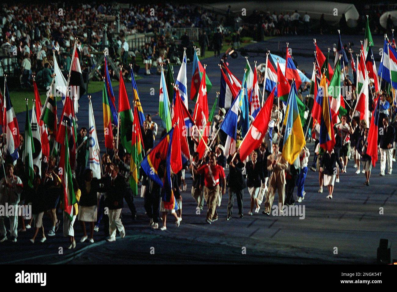 The national flags are carried into the Olympic Stadium at the closing ...