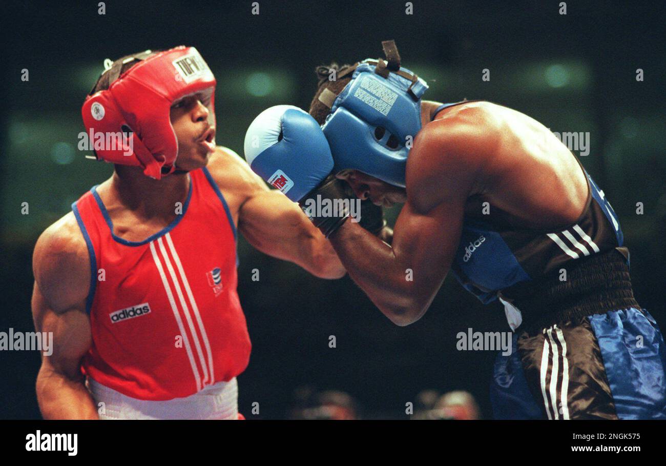 USA's David Reid, left, competes against Cuba's Alfredo Duvergel during ...