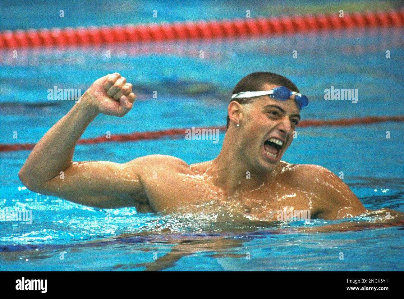 U.S. swimmer Matt Biondi celebrates winning his fourth Olympic gold ...