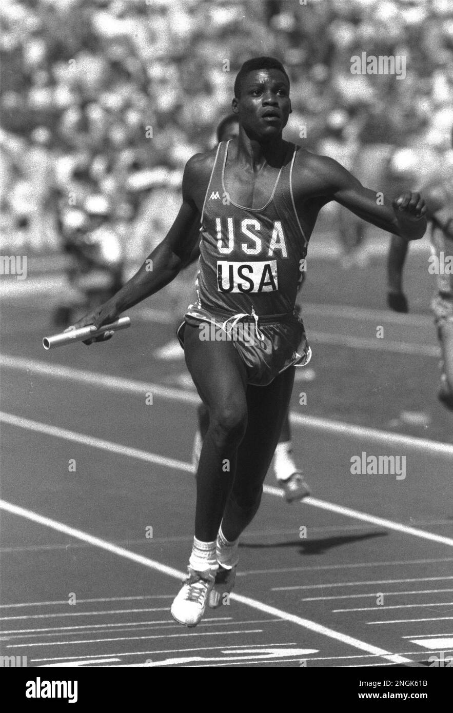 The United State's Carl Lewis takes the baton as he starts out on the ...