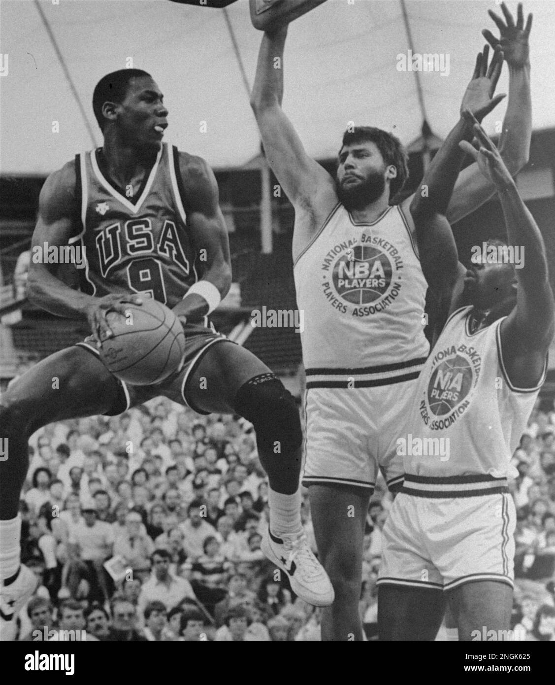 NBA All Stars Chris Engler, center, and Earvin "Magic" Johnson, right ...