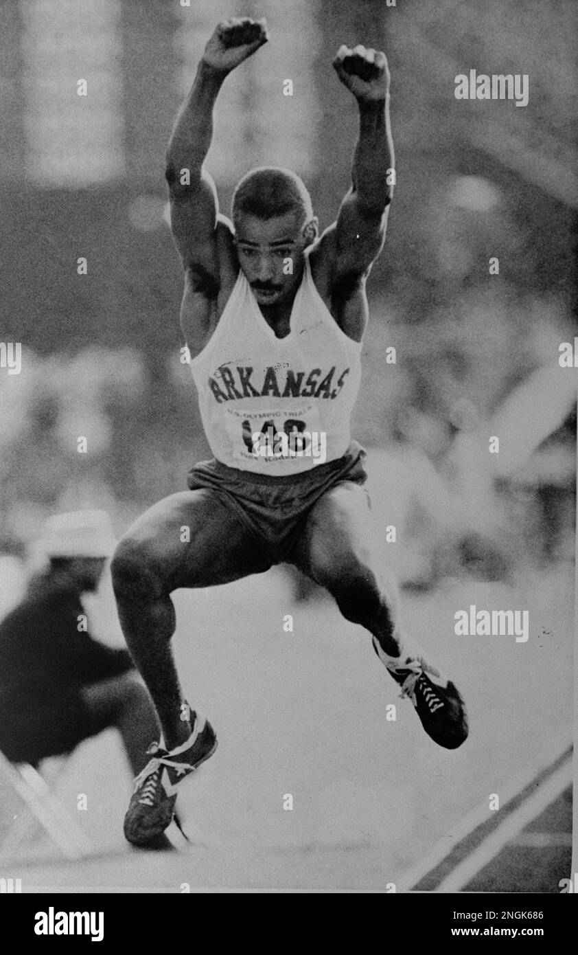 Mike Conley, of Chicago, sails through the air enroute to winning 57 ...