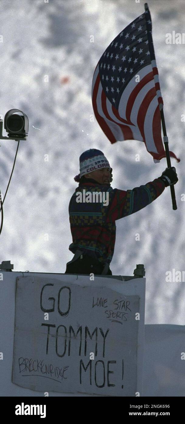 A fan of American Tommy Moe waves the flag in the finish area of the ...