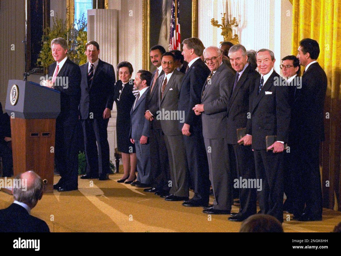 President Clinton speaks at the White House Friday as members of his ...