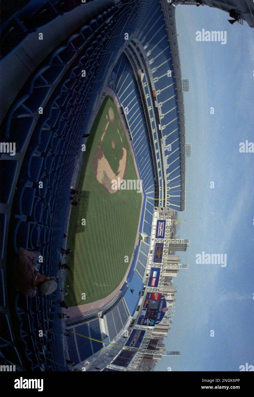A visitor sits in the outfield seats overlooking new Comiskey Park ...