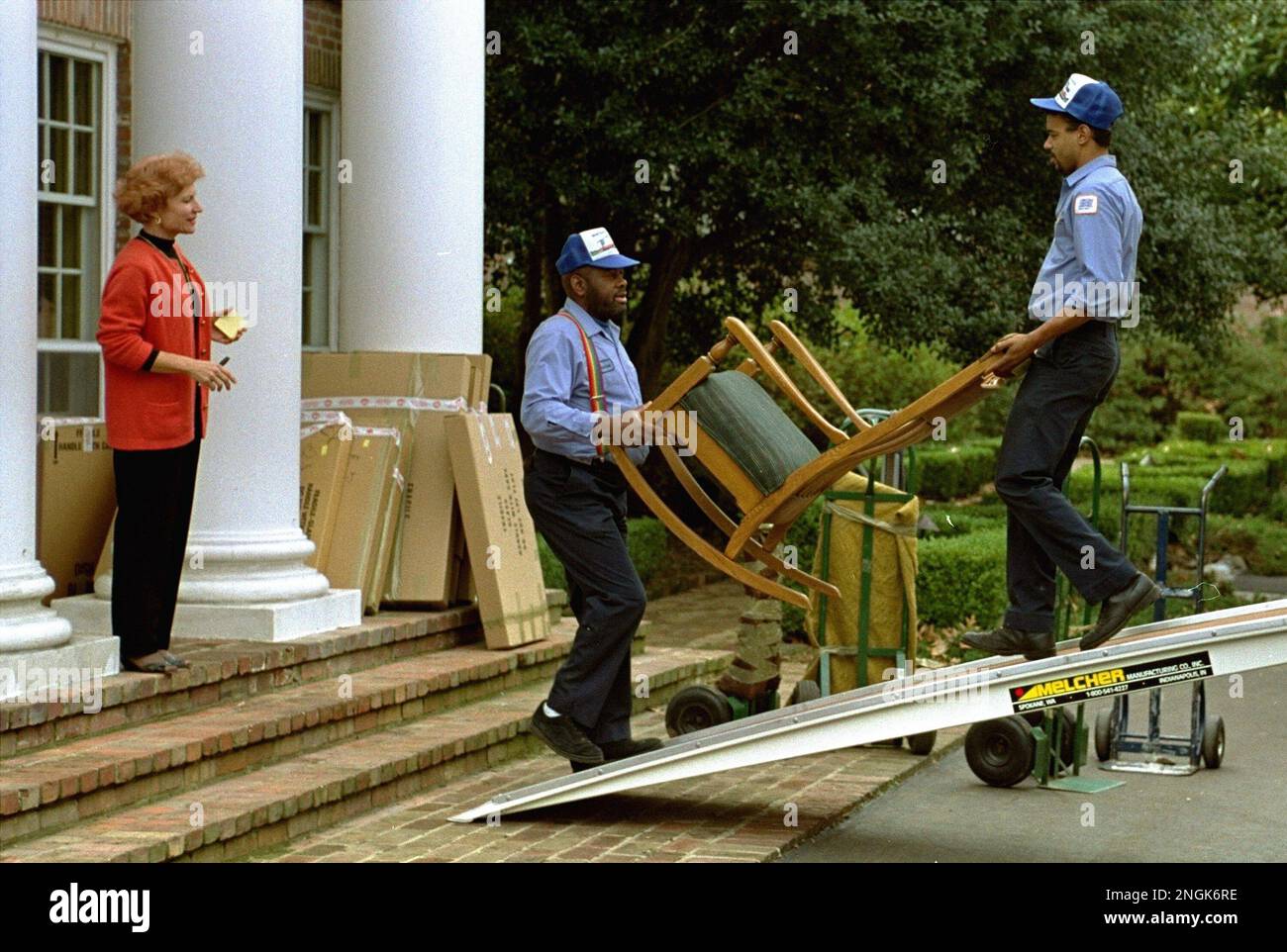 Workers load President Bill Clinton's favorite rocking chair onto a ...