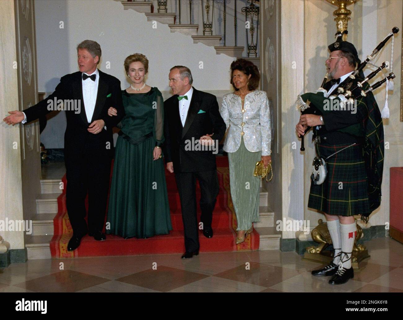 President and First Lady Hillary Rodham Clinton, left, lead the way as ...