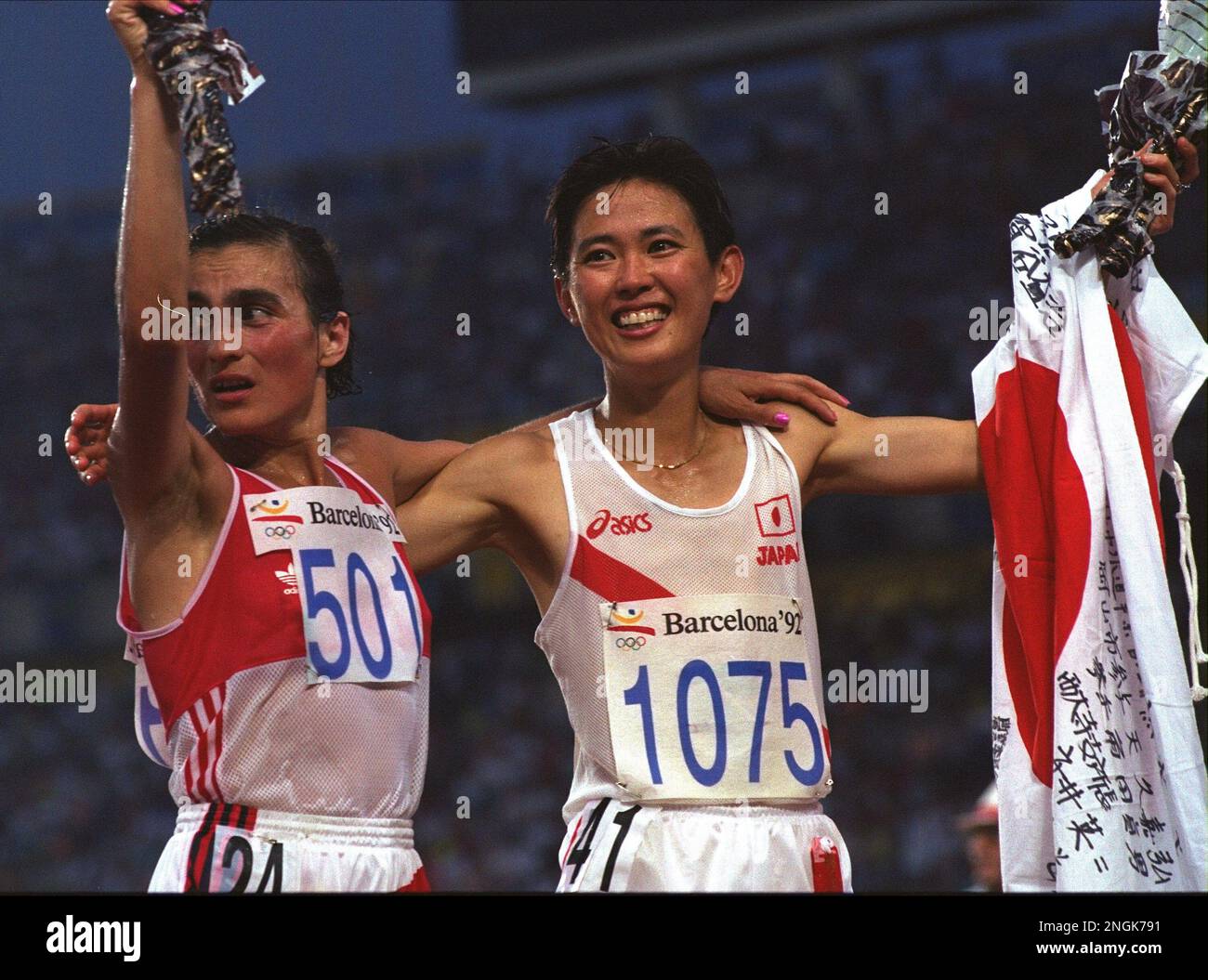 Valentina Yegorova of the Unified Team, left, and Yuko Arimori of Japan celebrate after ...