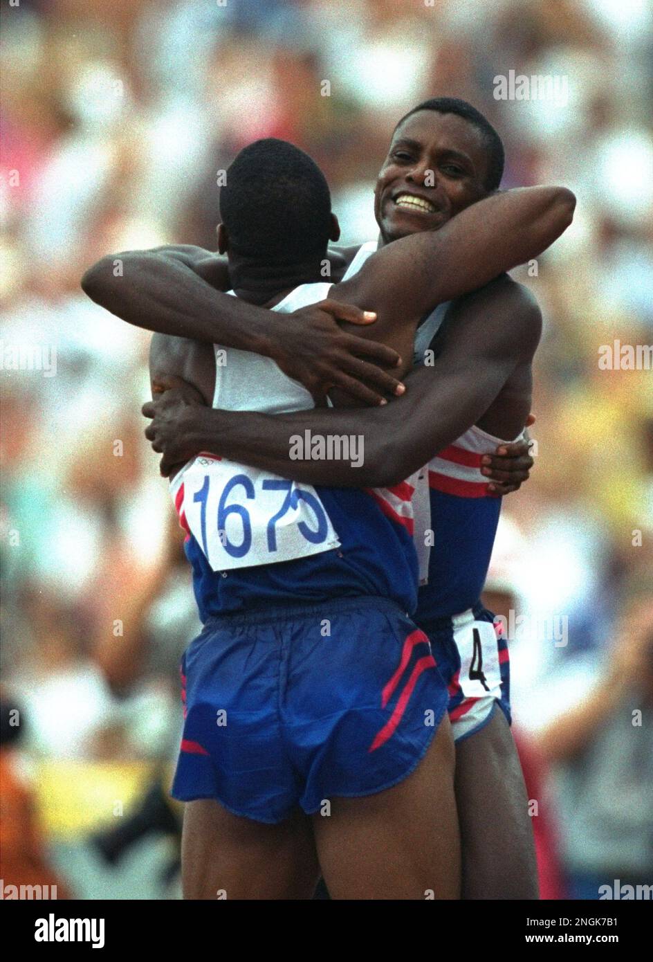 The USA's Carl Lewis, Houston, Tex., embraces teammate Leroy Burrell ...