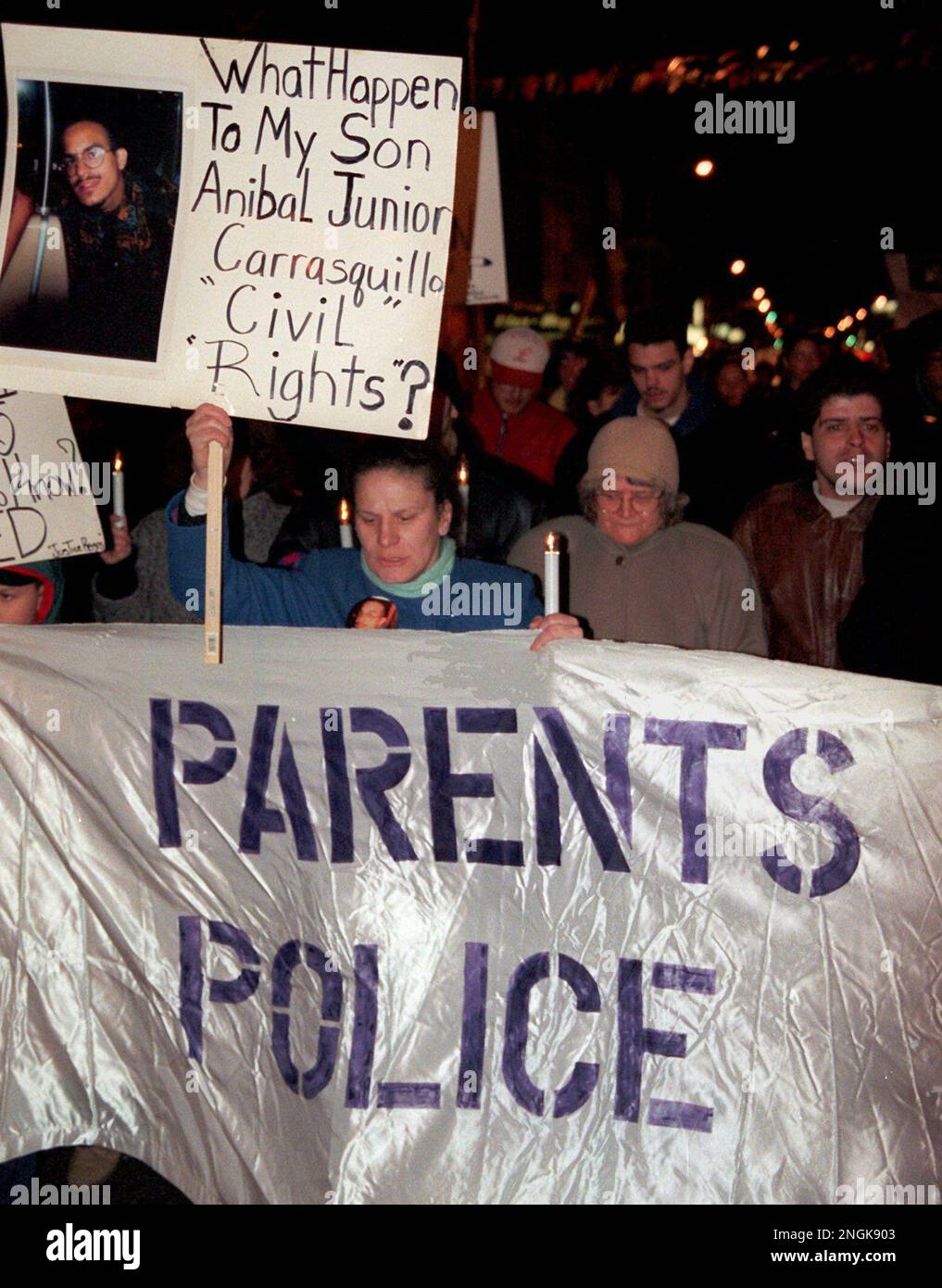Dozens of residents of the Flatbush section of New York hold a ...