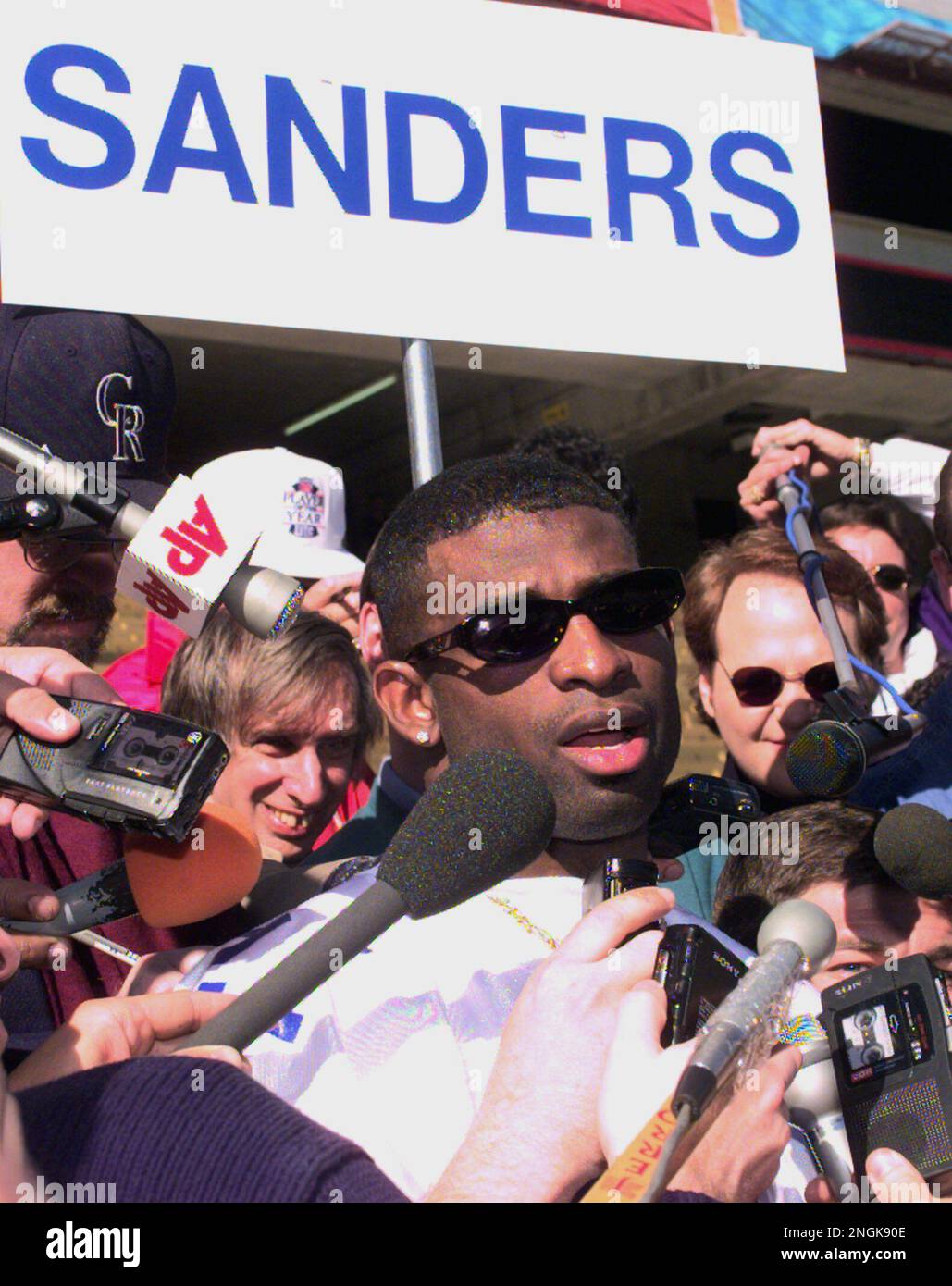 Dallas Cowboys cornerback Deion Sanders talks with reporters at the ... Dallas Cowboys cornerback Deion Sanders talks with reporters at the ...