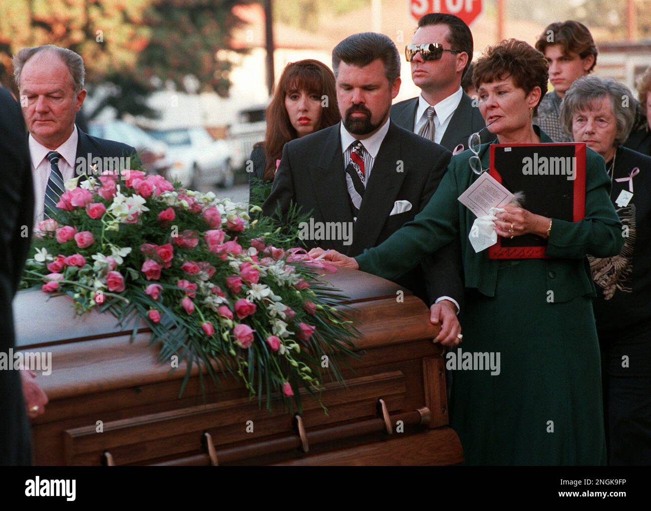 Linda Sobek's parents Bob Sobek, left, and Elaine, right, guide their ...