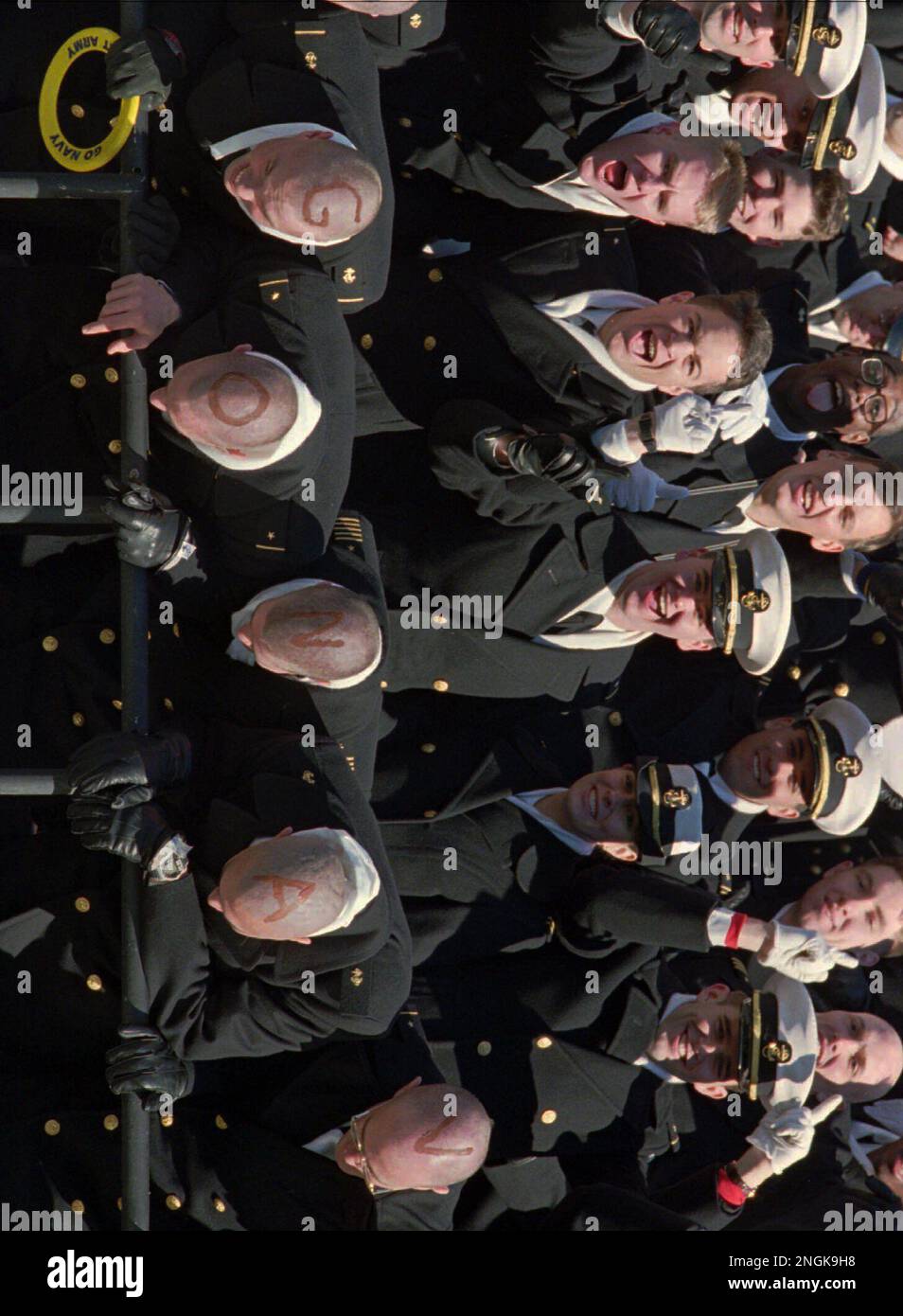 Midshipmen from the Naval Academy use their heads and hands to show ...