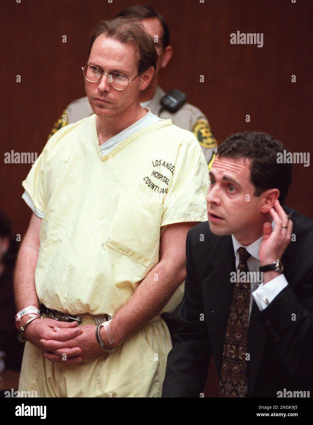 Defendant Charles Rathbun, left, stands in court alongside his attorney ...