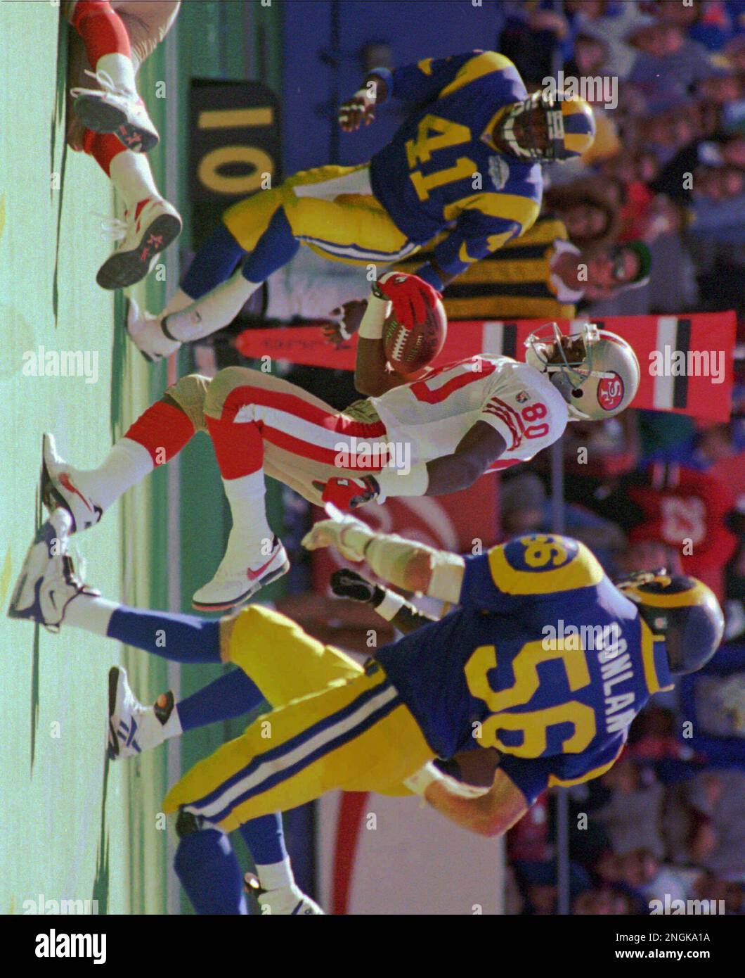 San Francisco 49ers Jerry Rice (80) makes a 20-yard run towards the end ...