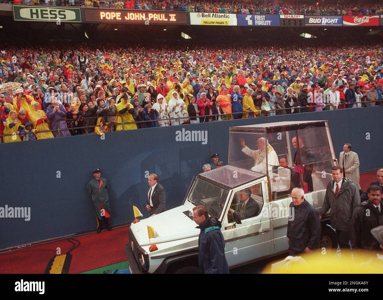 Pope John Paul II waves to the crowd as he tours Giants Stadium prior ...