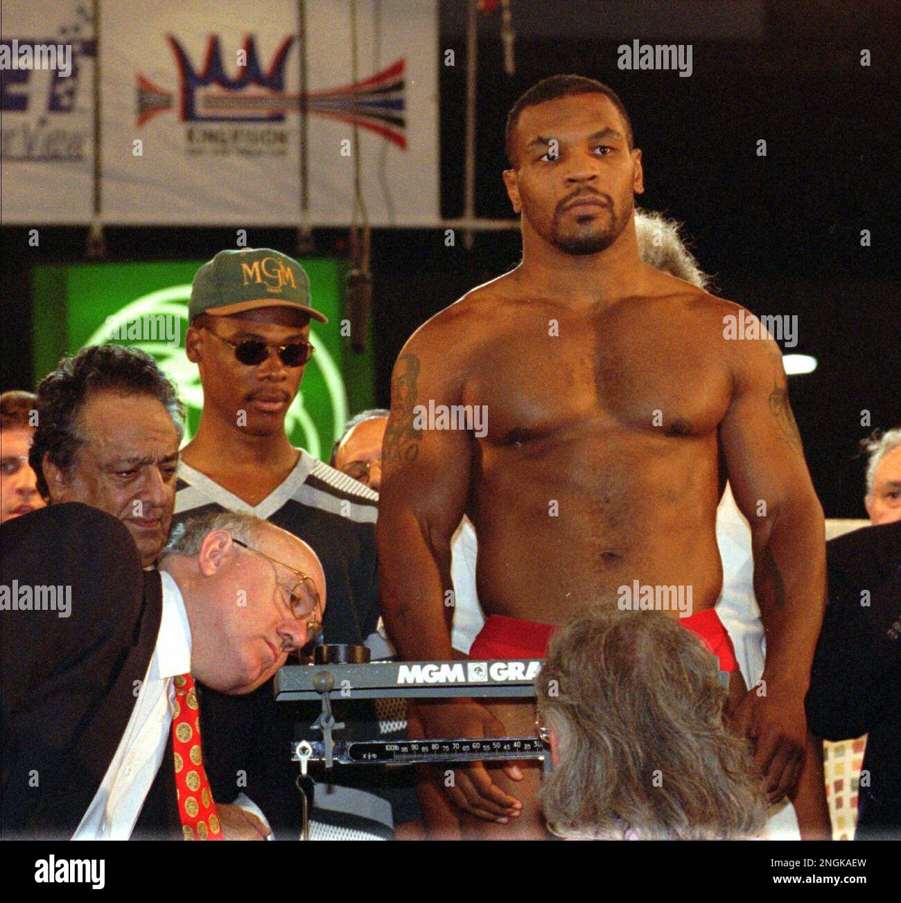 Boxing officials watch as former heavyweight champion Mike Tyson, right ...